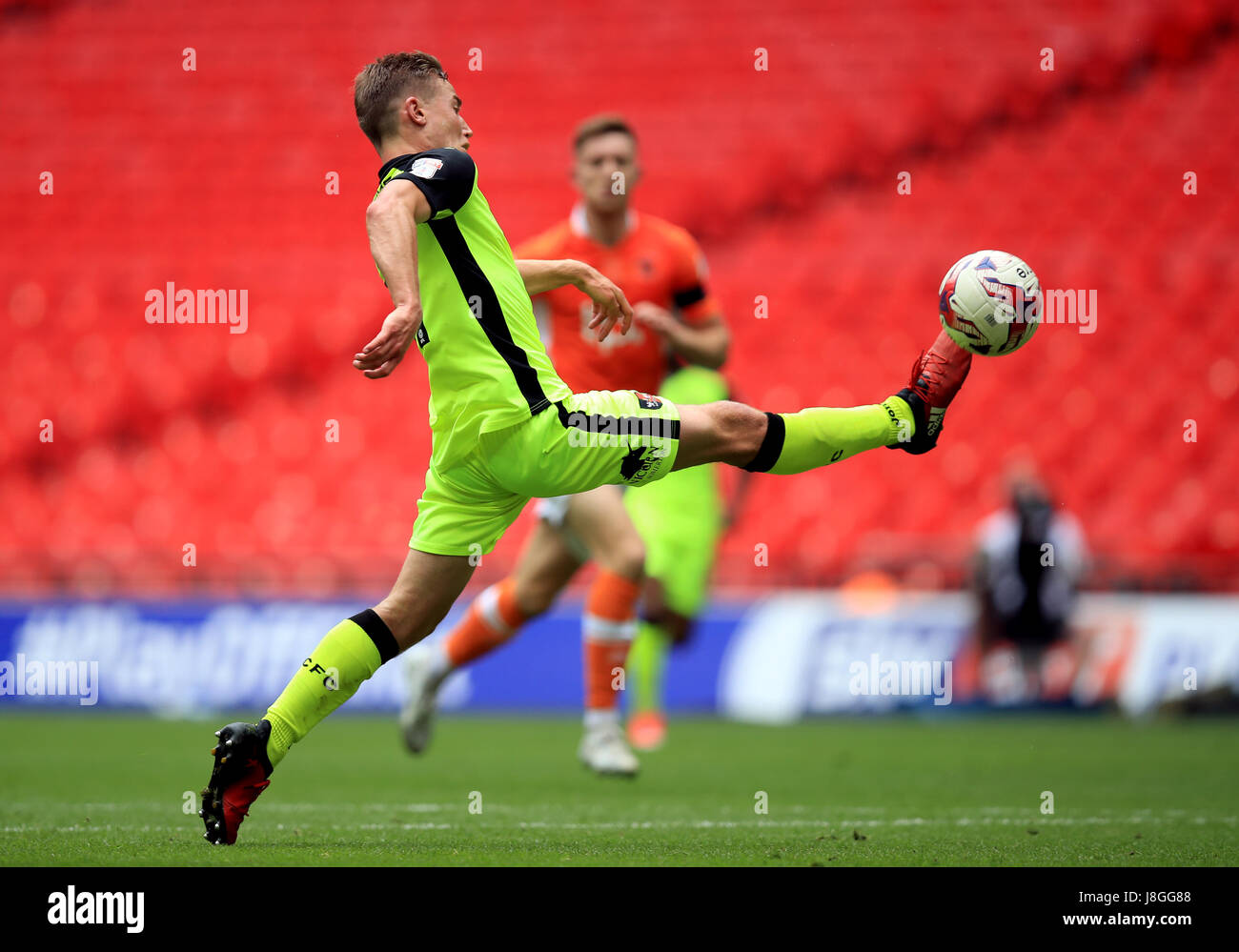 Exeter City's David Wheeler scores his side's first goal of the game ...