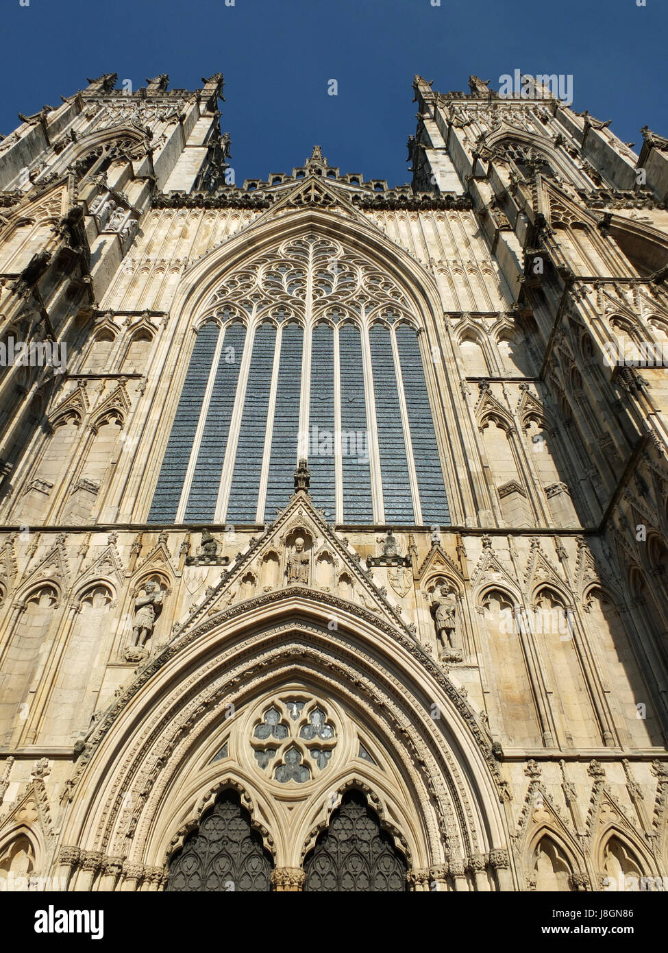 york minster window above main doorway Stock Photo - Alamy