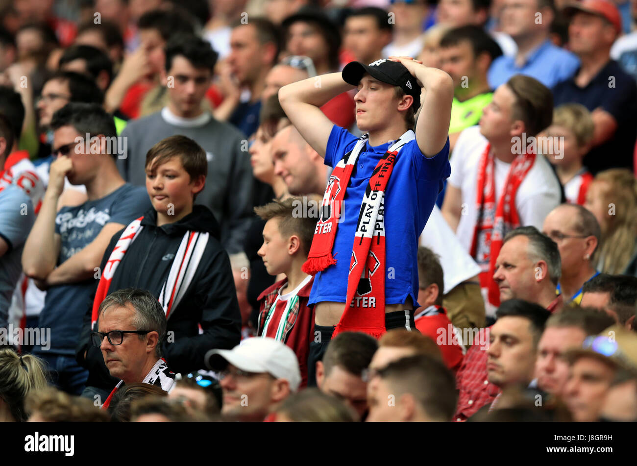 Exeter City fans appear dejected in the stands during the Sky Bet ...