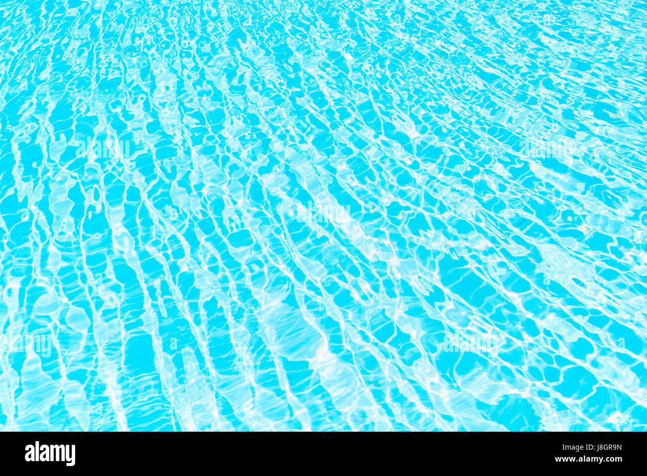 beautiful clear blue water in swimming pool background Stock Photo - Alamy