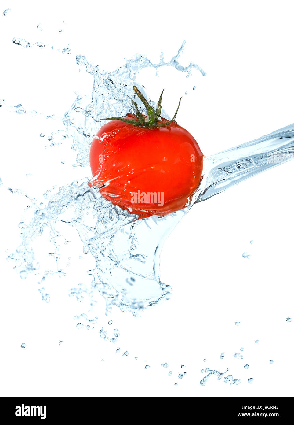 fresh ripe tomato in water splashes isolated on white background with ...