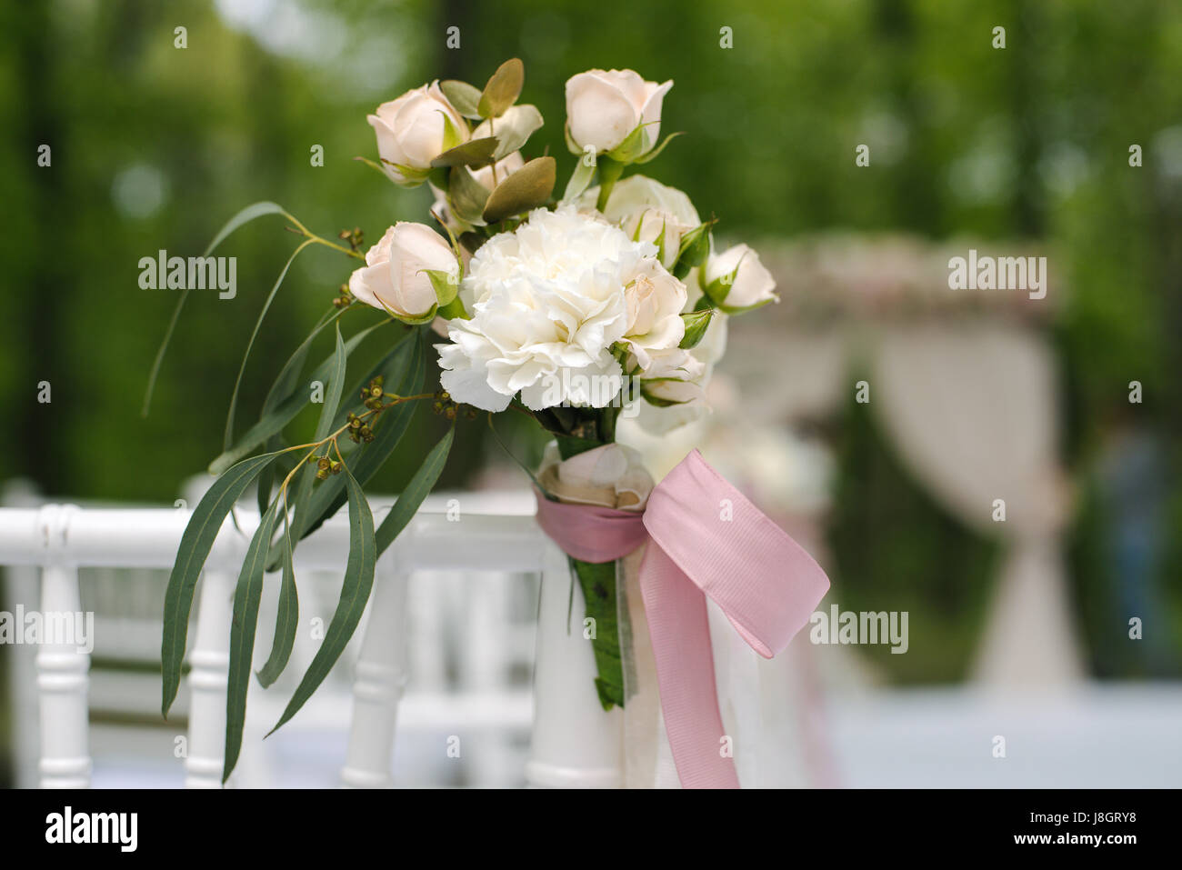 Pink ranunculus and roses buds in tenderless boutonniere, closeup Stock ...
