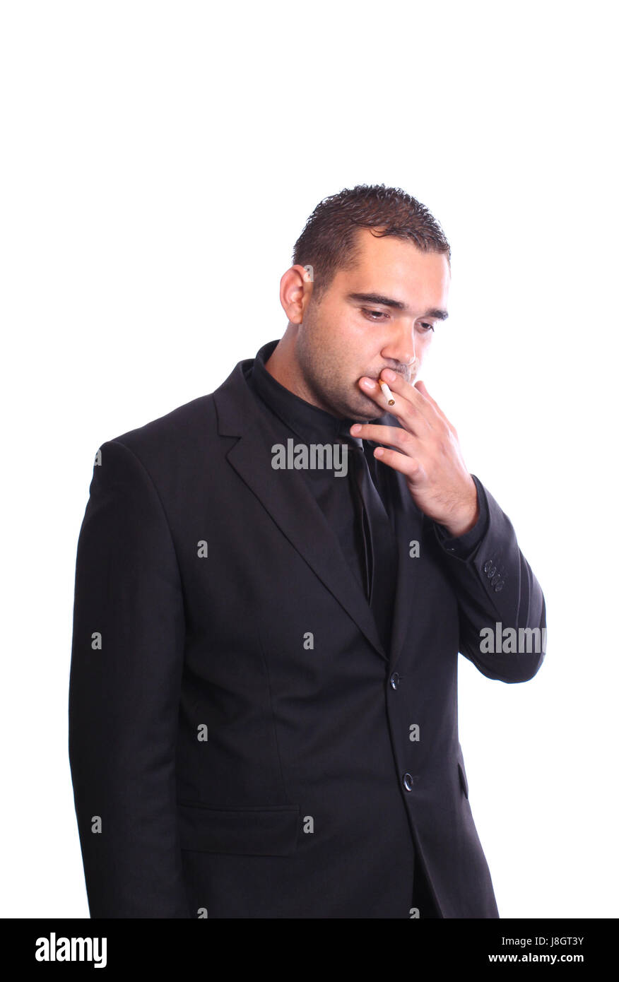 Man in black smoking Stock Photo - Alamy