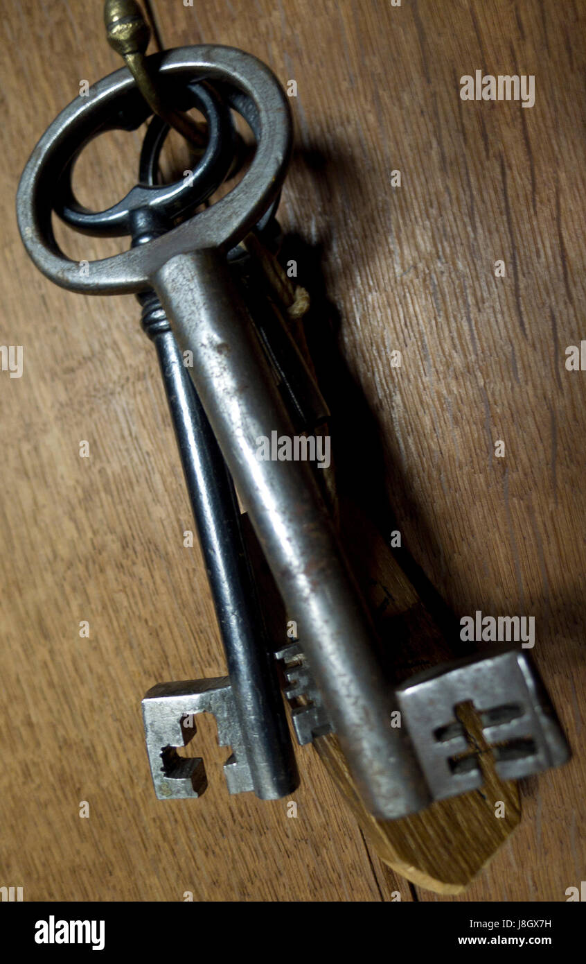 Old vintage iron keys hanging on a hook Stock Photo - Alamy
