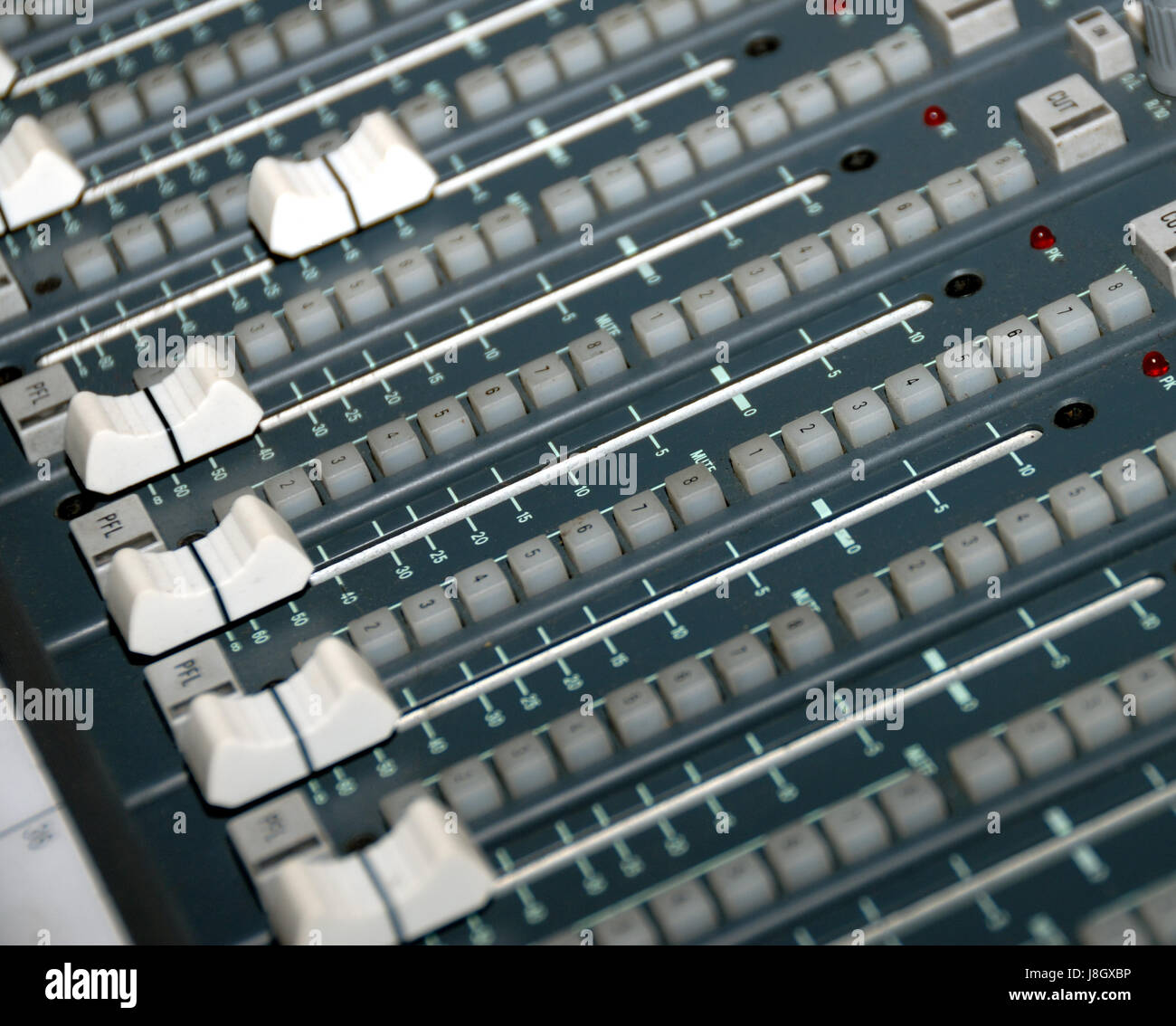 Audio mixing console in a recording studio. Faders and knobs of a sound ...