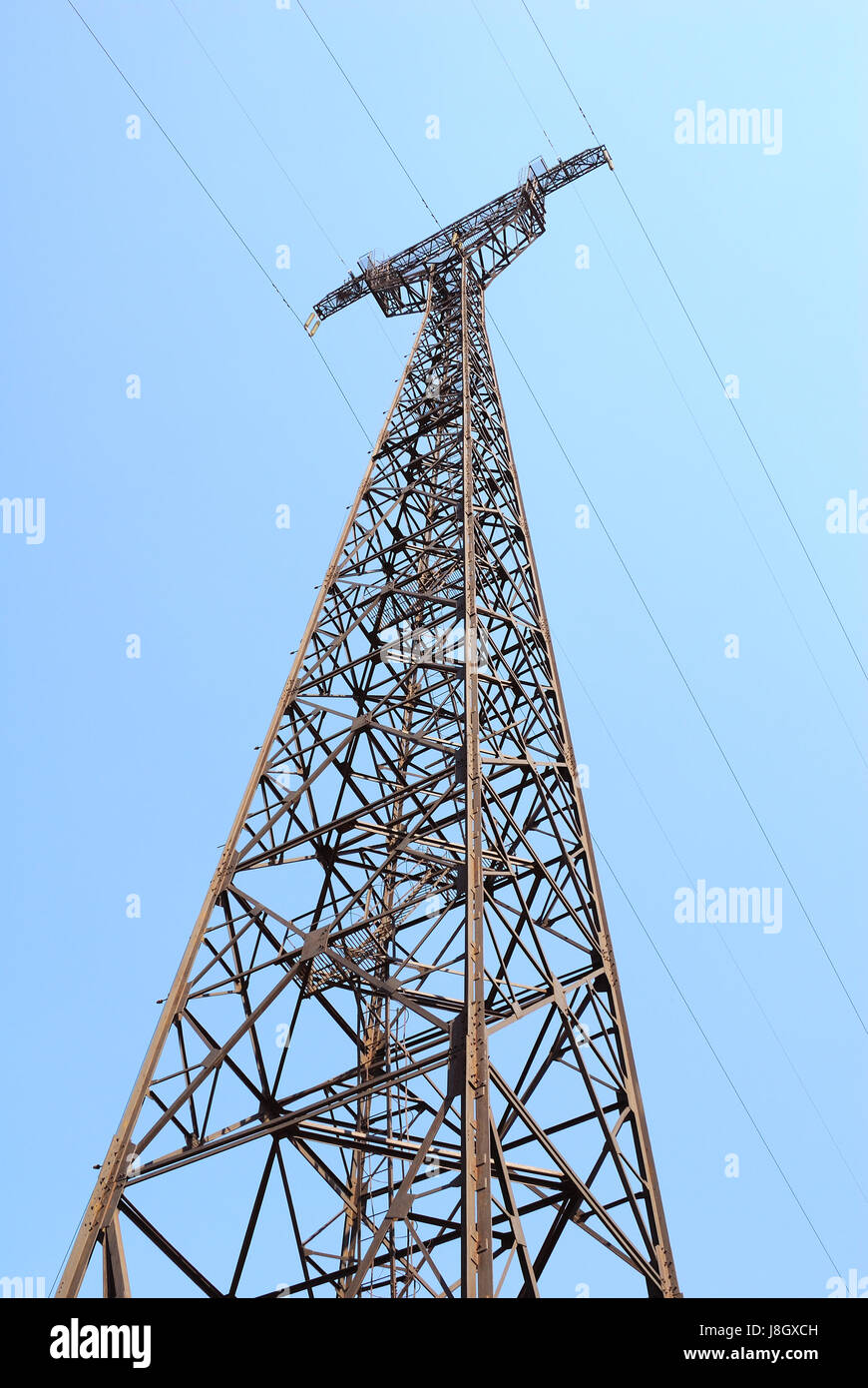 High voltage Electricity pylon against blue sky Stock Photo - Alamy