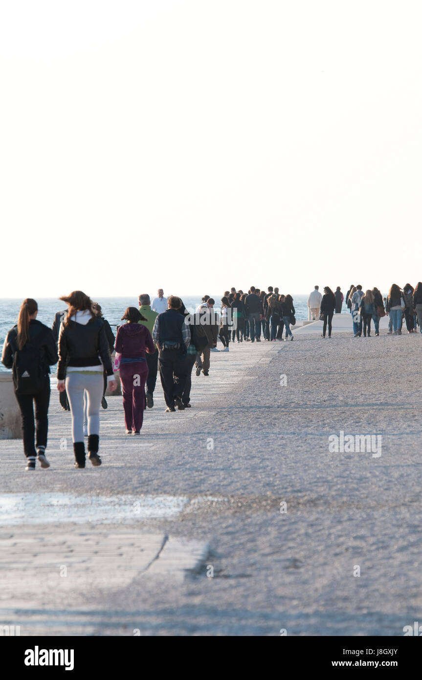 A group of people taking a walk a long the Boulevard Stock Photo - Alamy