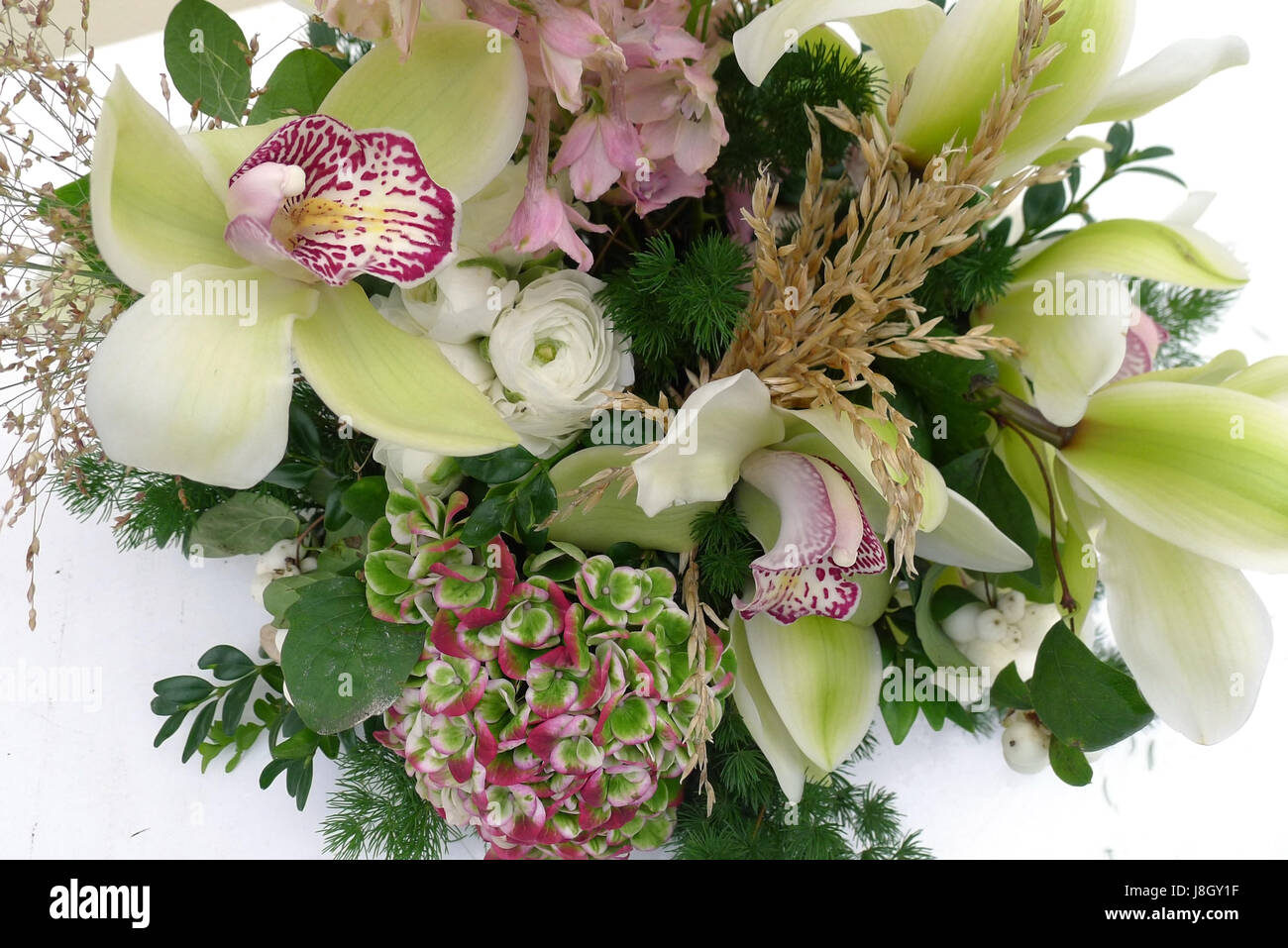 A beautiful bouquet consisting of Hydrangea and Orchids among other ...