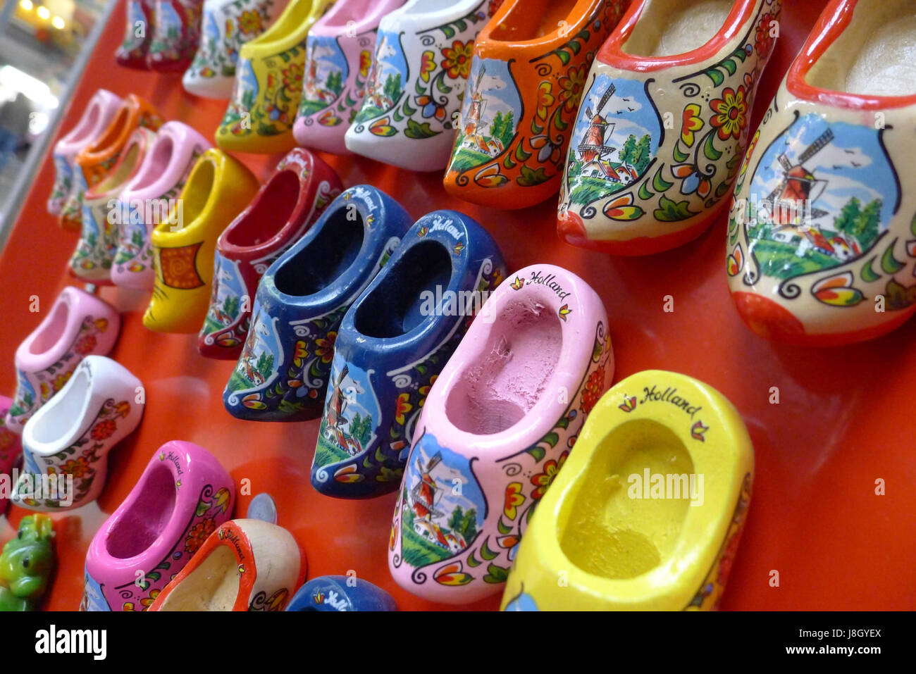 A collection of clogs in various colours with lovely decorations ...