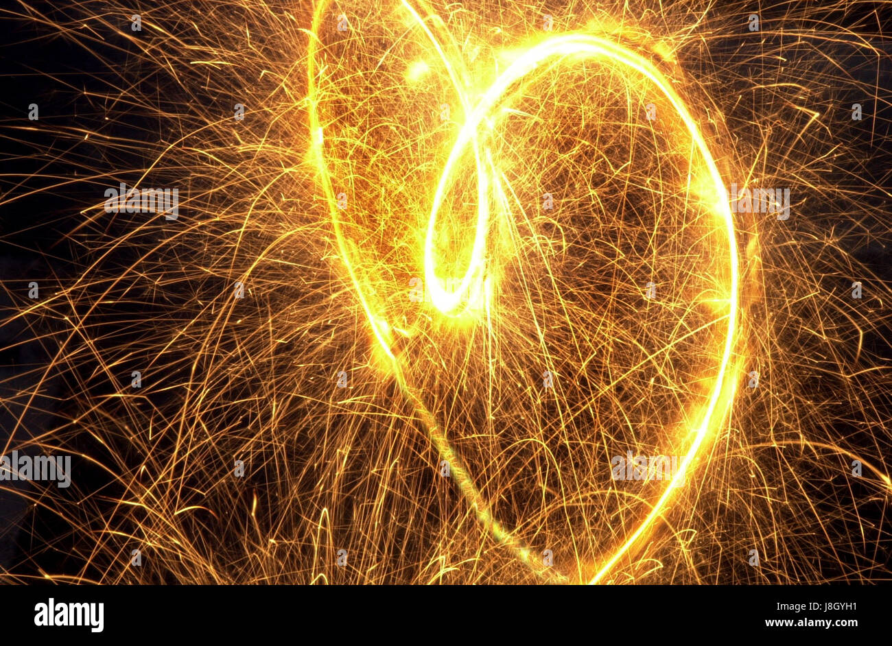 A heart burning gold in the darkness of the night as its sparks fly ...