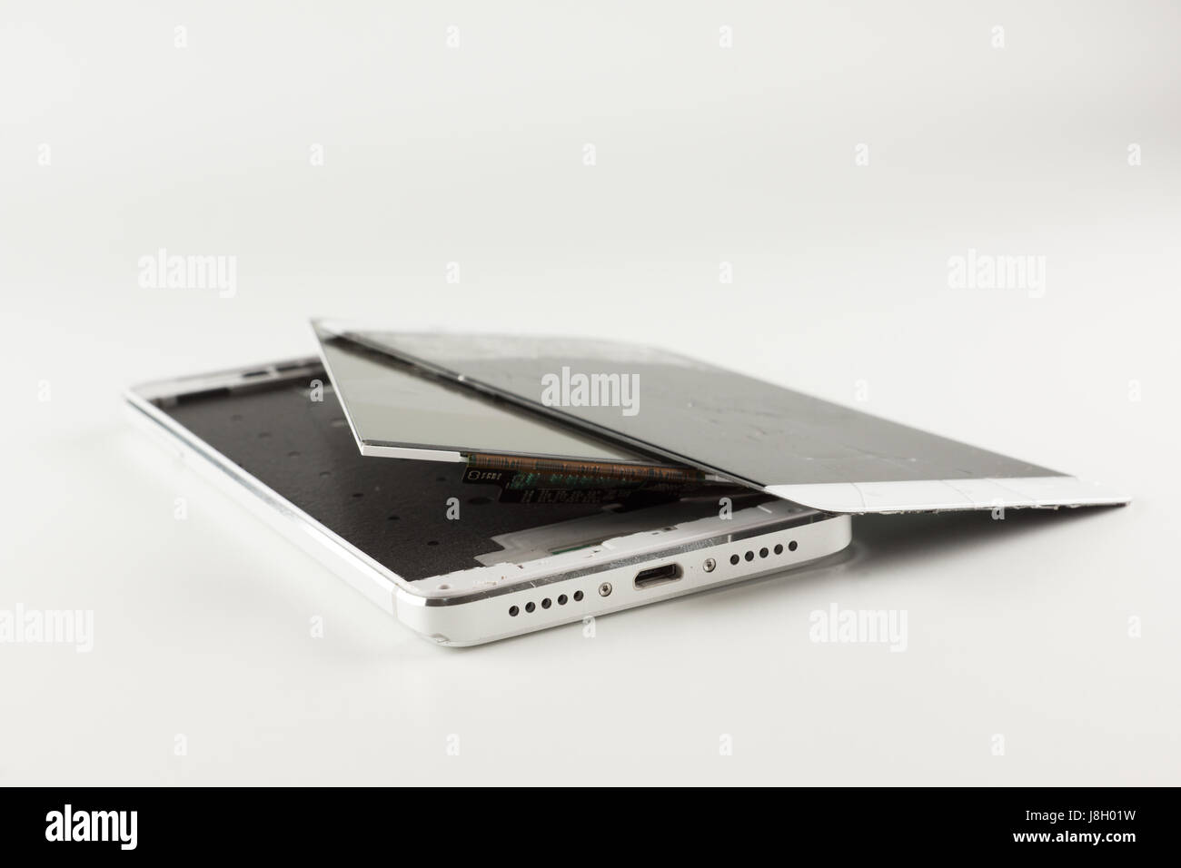 Broken into separate spare parts mobile phone Stock Photo - Alamy