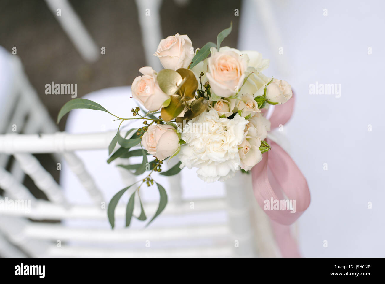 Pink ranunculus and roses buds in tenderless boutonniere, closeup Stock ...