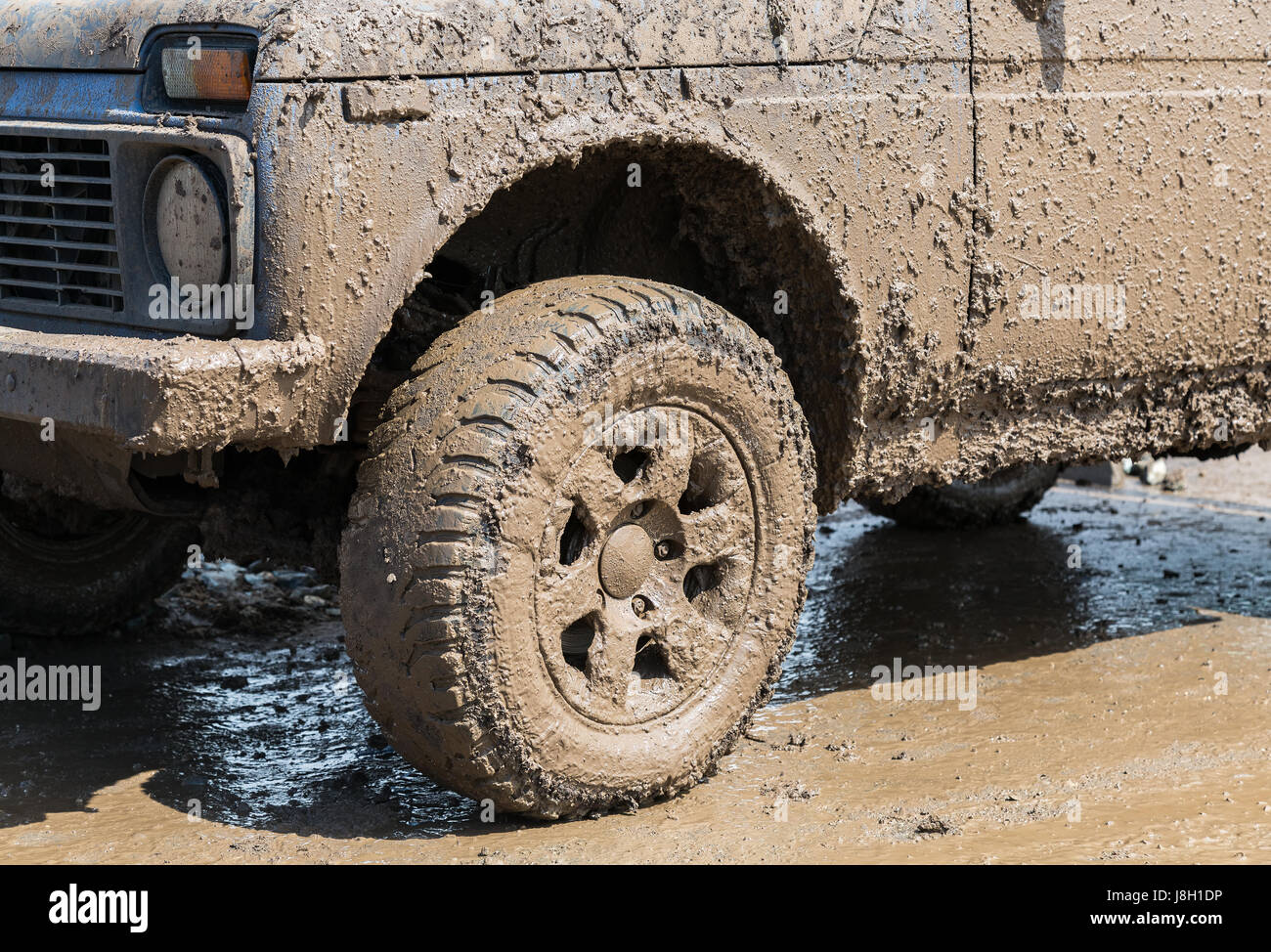 Dirty wheel of an off-road car after driving in the rain Stock Photo ...