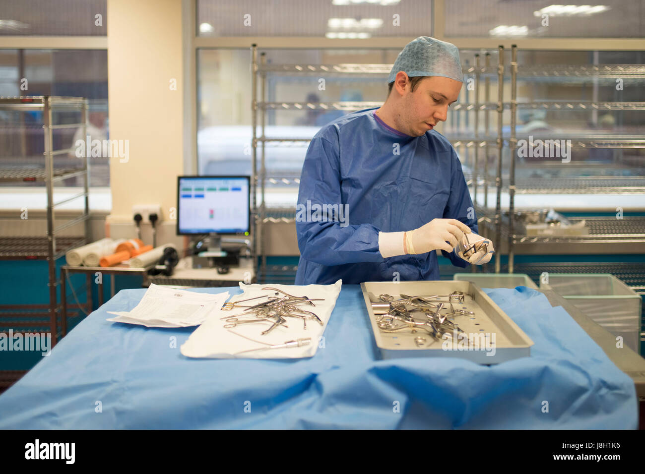 Surgical instruments being cleaned and sterilised at a hospital by a ...