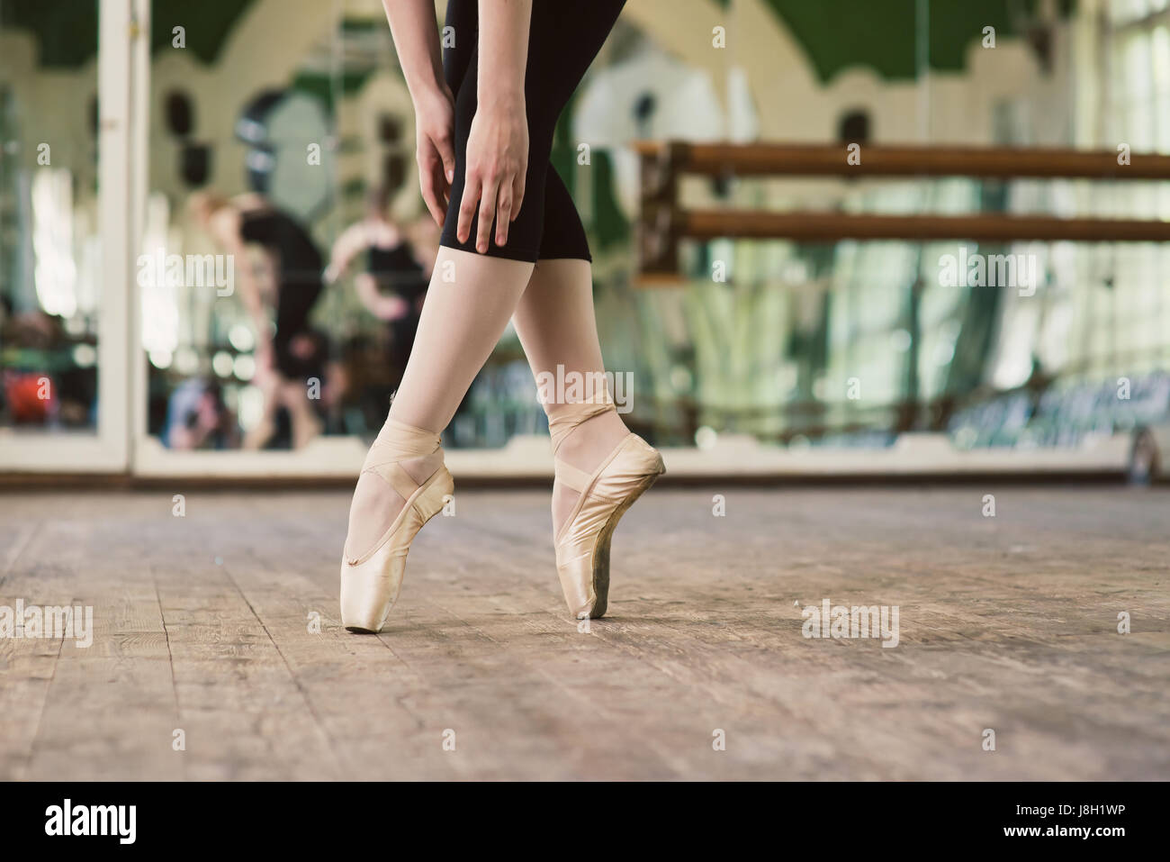 Ballerina standing on toes. Closeup of dancing legs of ballerina ...
