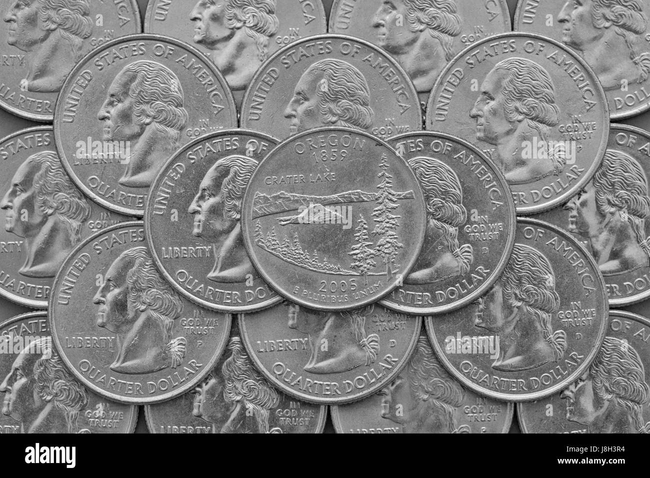 Oregon State and coins of USA. Pile of the US quarter coins with George ...