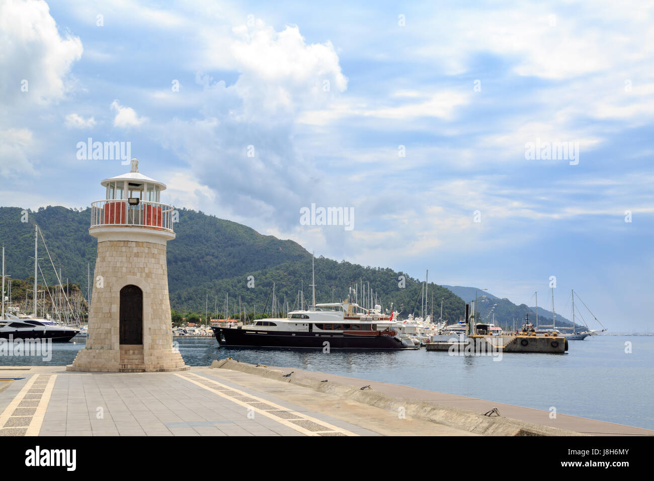 Lighthouse inside the marmaris harbor with marina background Stock ...