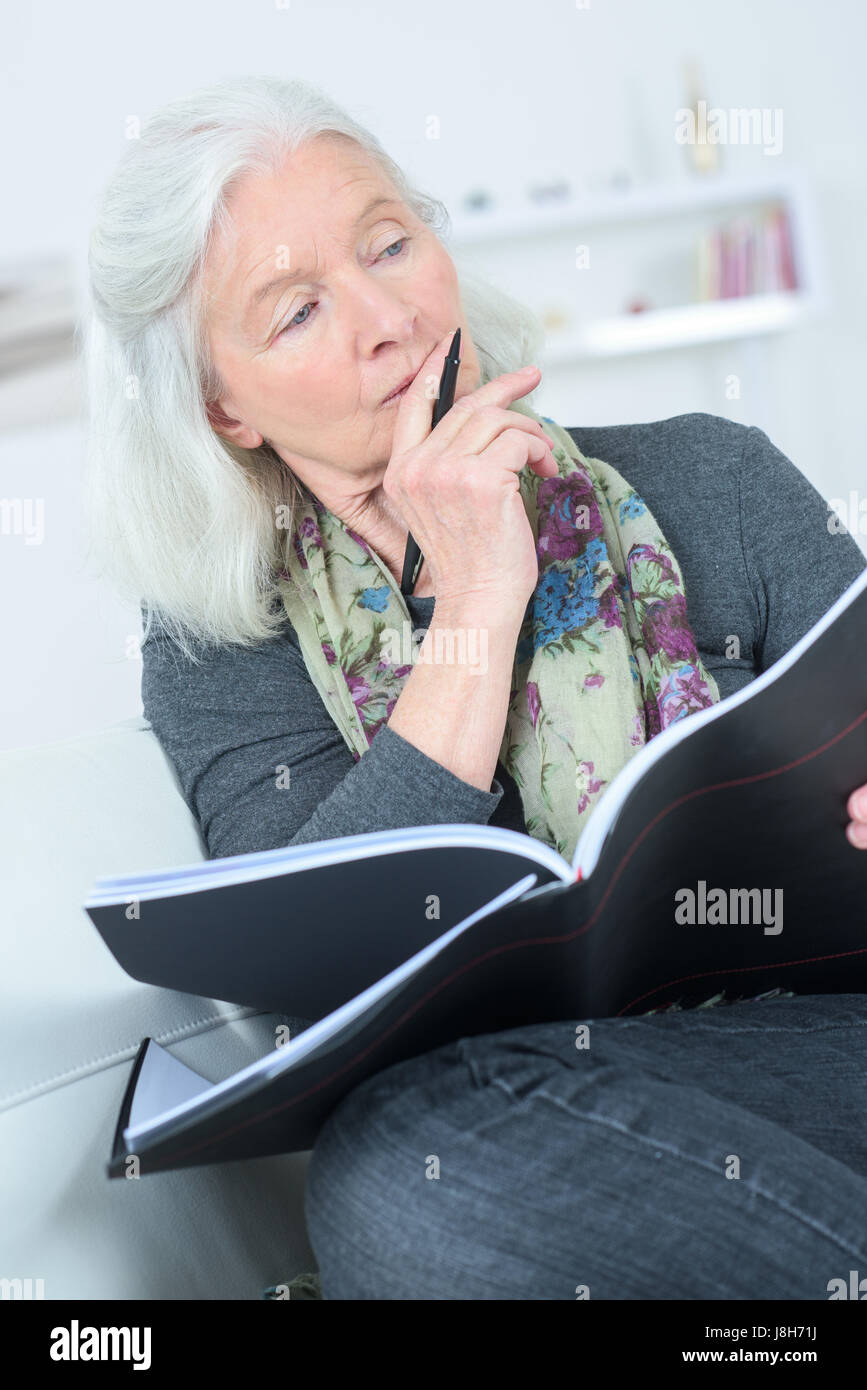 elderly woman with book Stock Photo - Alamy