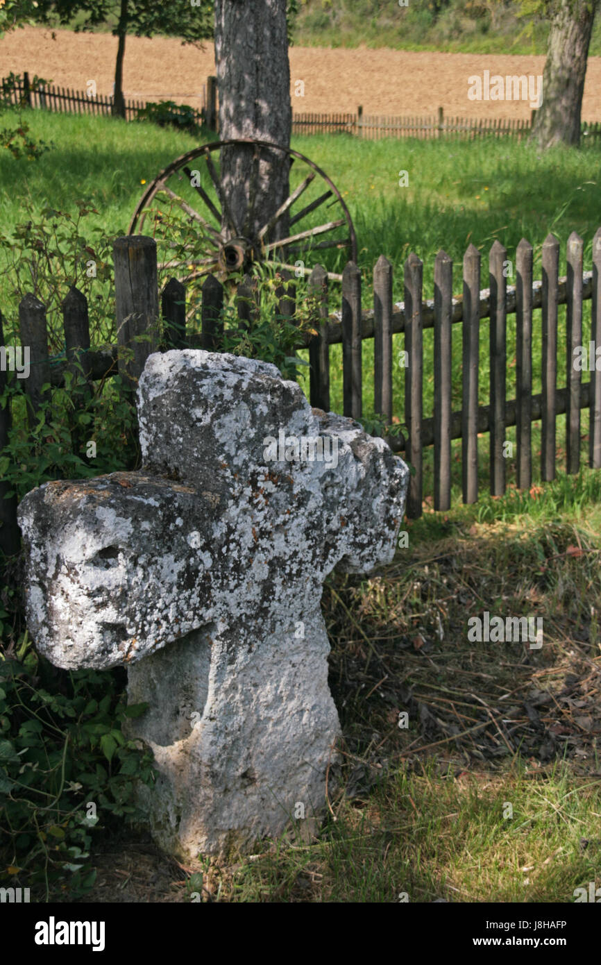 stone cross in front wooden fence - lonetal - germany Stock Photo - Alamy