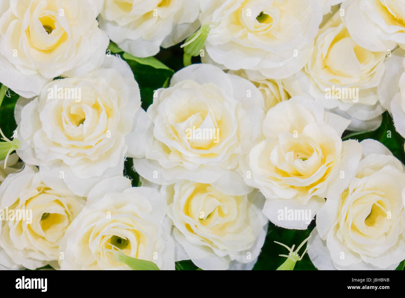 Rose fake flower and Floral background. The fabric flowers bouquet ...