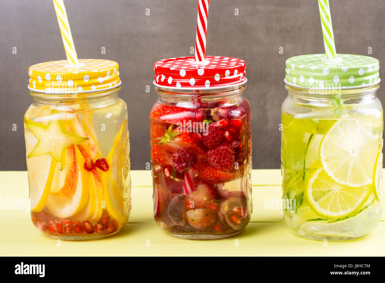 Fresh fruits flavored water healthy detox drinks in jars Stock Photo ...