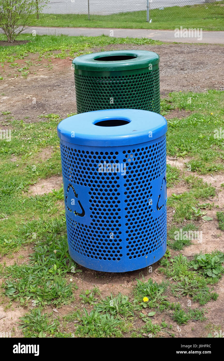 Two recycling cans in a park Stock Photo - Alamy
