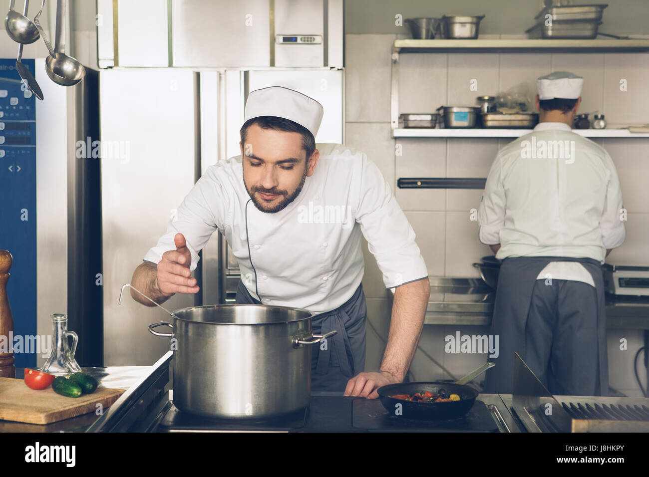 Man japanese restaurant chef cooking in the kitchen Stock Photo - Alamy