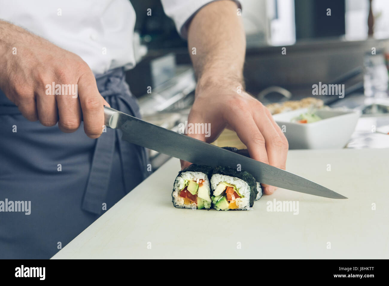 Man japanese restaurant chef cooking in the kitchen Stock Photo - Alamy