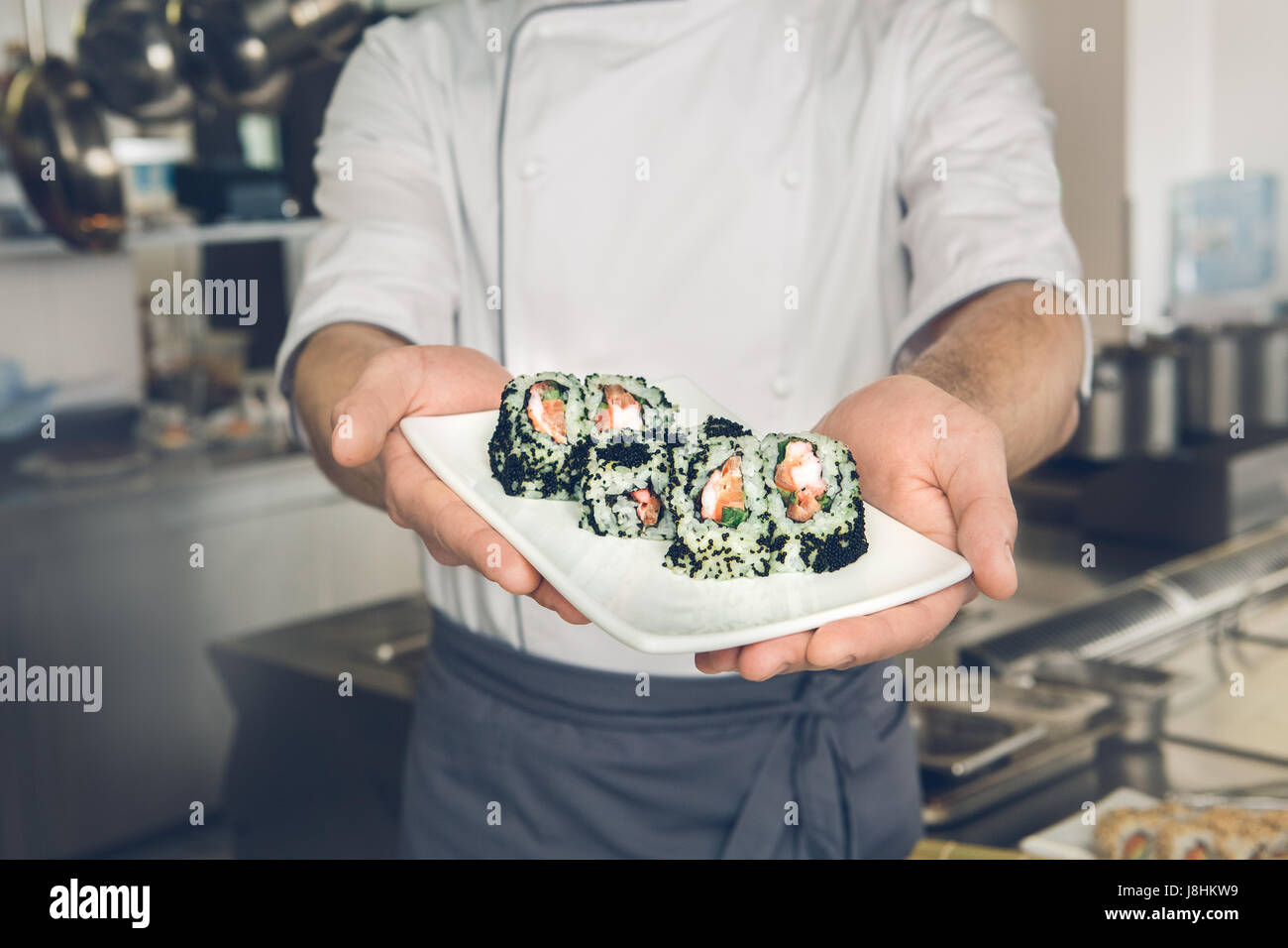 Man japanese restaurant chef cooking in the kitchen Stock Photo - Alamy