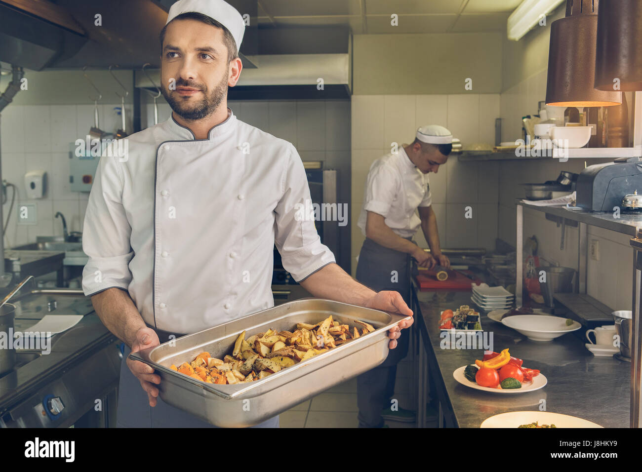 Man japanese restaurant chef cooking in the kitchen Stock Photo - Alamy