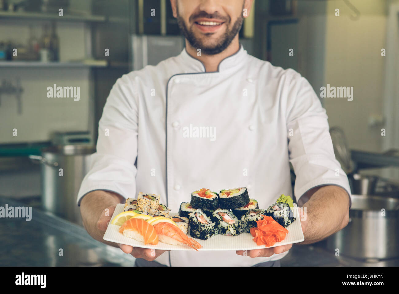 Man japanese restaurant chef cooking in the kitchen Stock Photo - Alamy