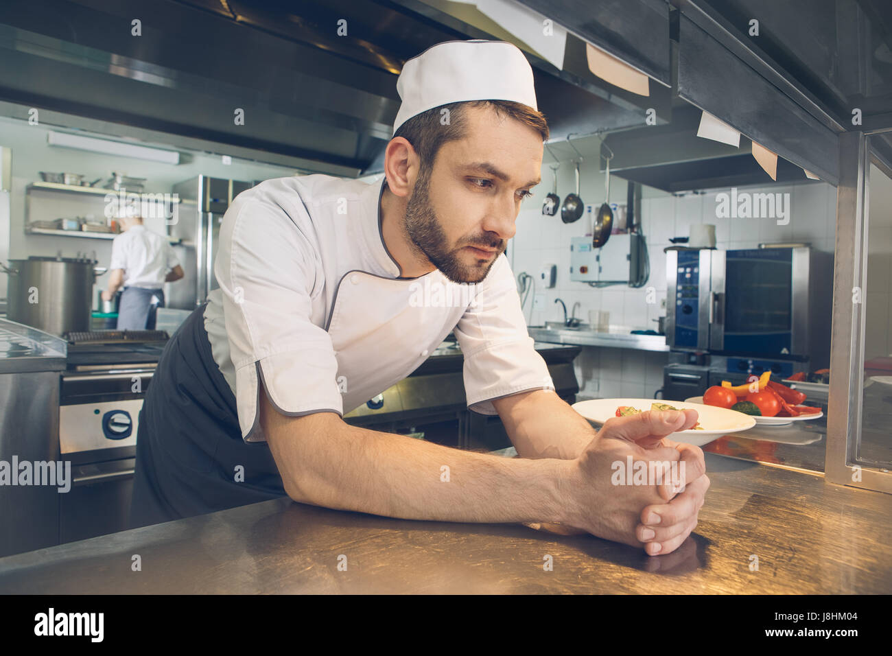 Man japanese restaurant chef cooking in the kitchen Stock Photo - Alamy