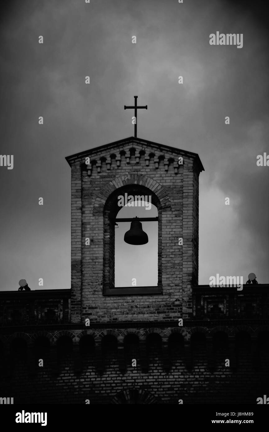 The bell tower of an old church with a hanging bell Stock Photo - Alamy