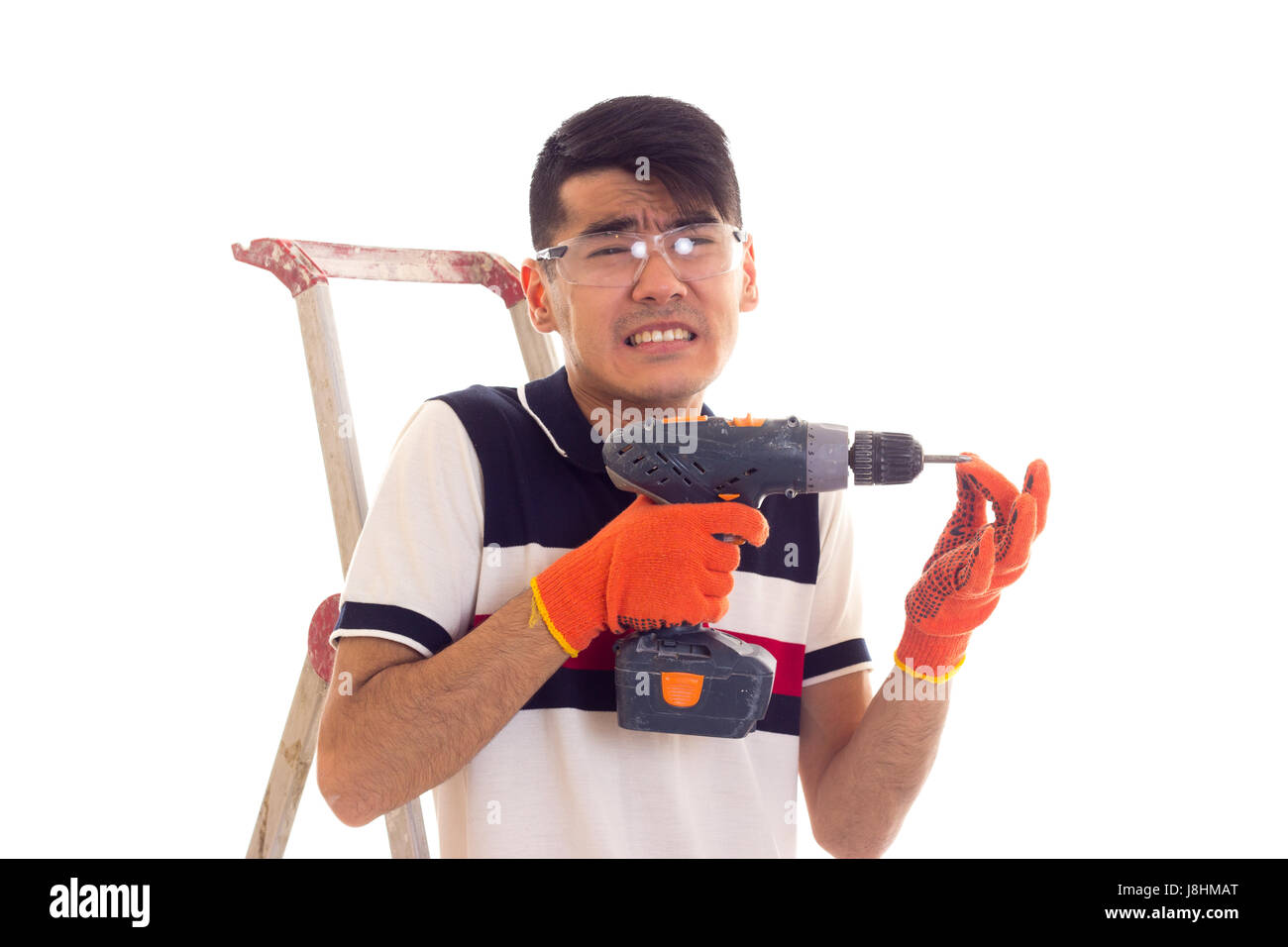 Young crying man with black hair in white and blue t-shirt with orange ...