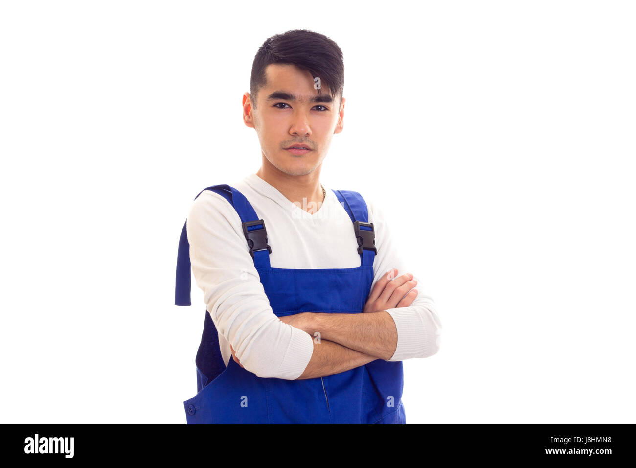 Man wearing blue overalls hi-res stock photography and images - Alamy
