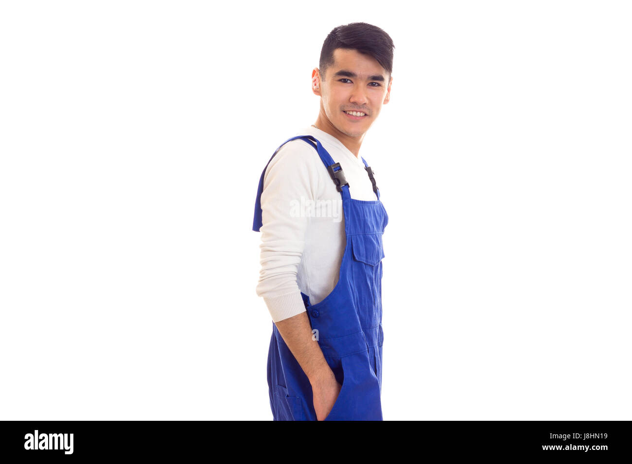 Man wearing blue overalls hi-res stock photography and images - Alamy