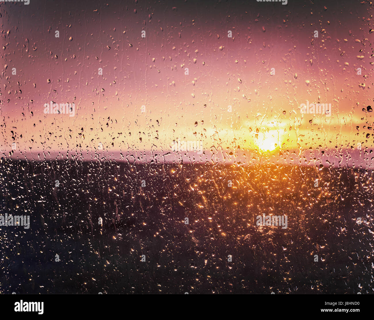 rainy dramatic sunset in window Stock Photo - Alamy