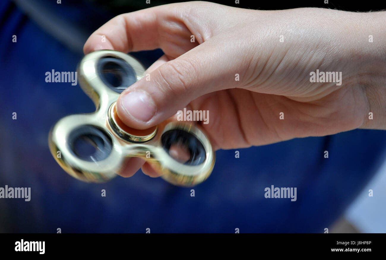 Hand running spinner Stock Photo - Alamy