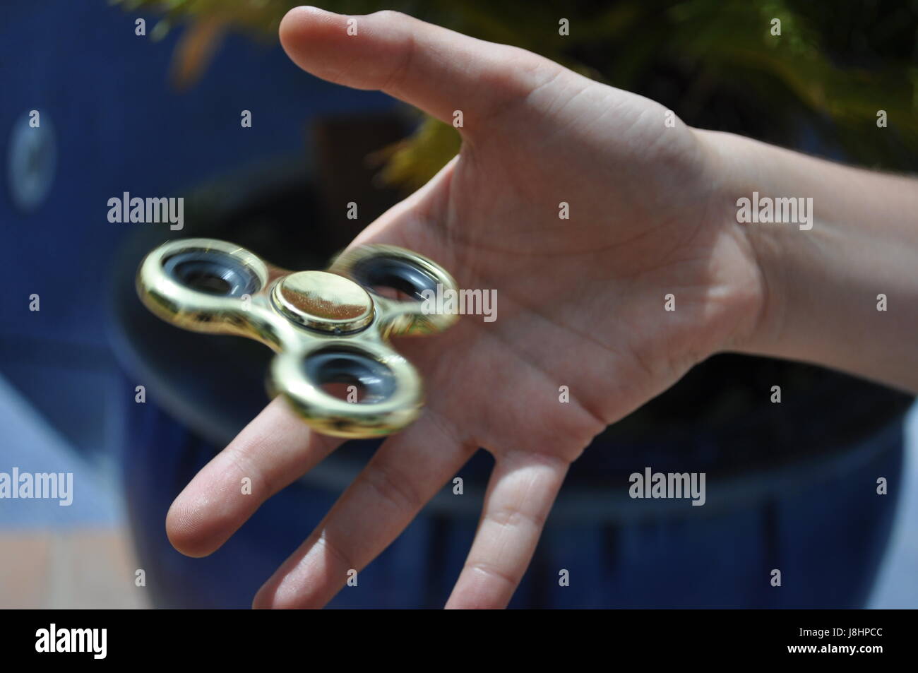 Hand running spinner Stock Photo - Alamy