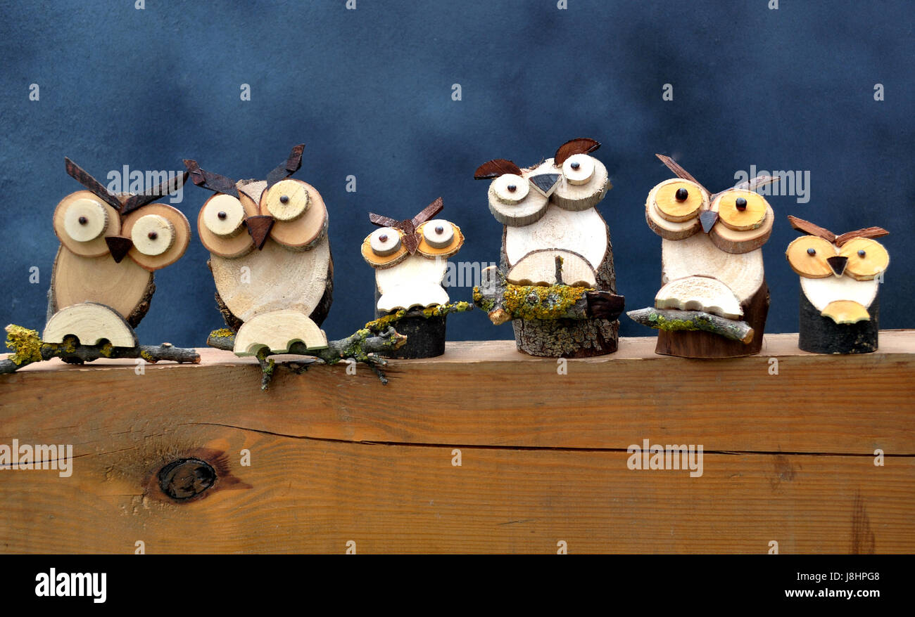Row owls handmade on wood Stock Photo - Alamy