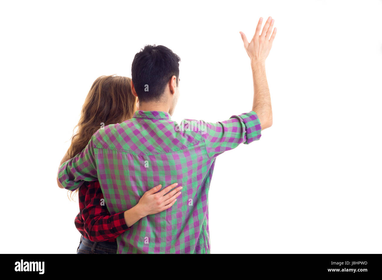 Young couple in plaid shirts hugging Stock Photo - Alamy