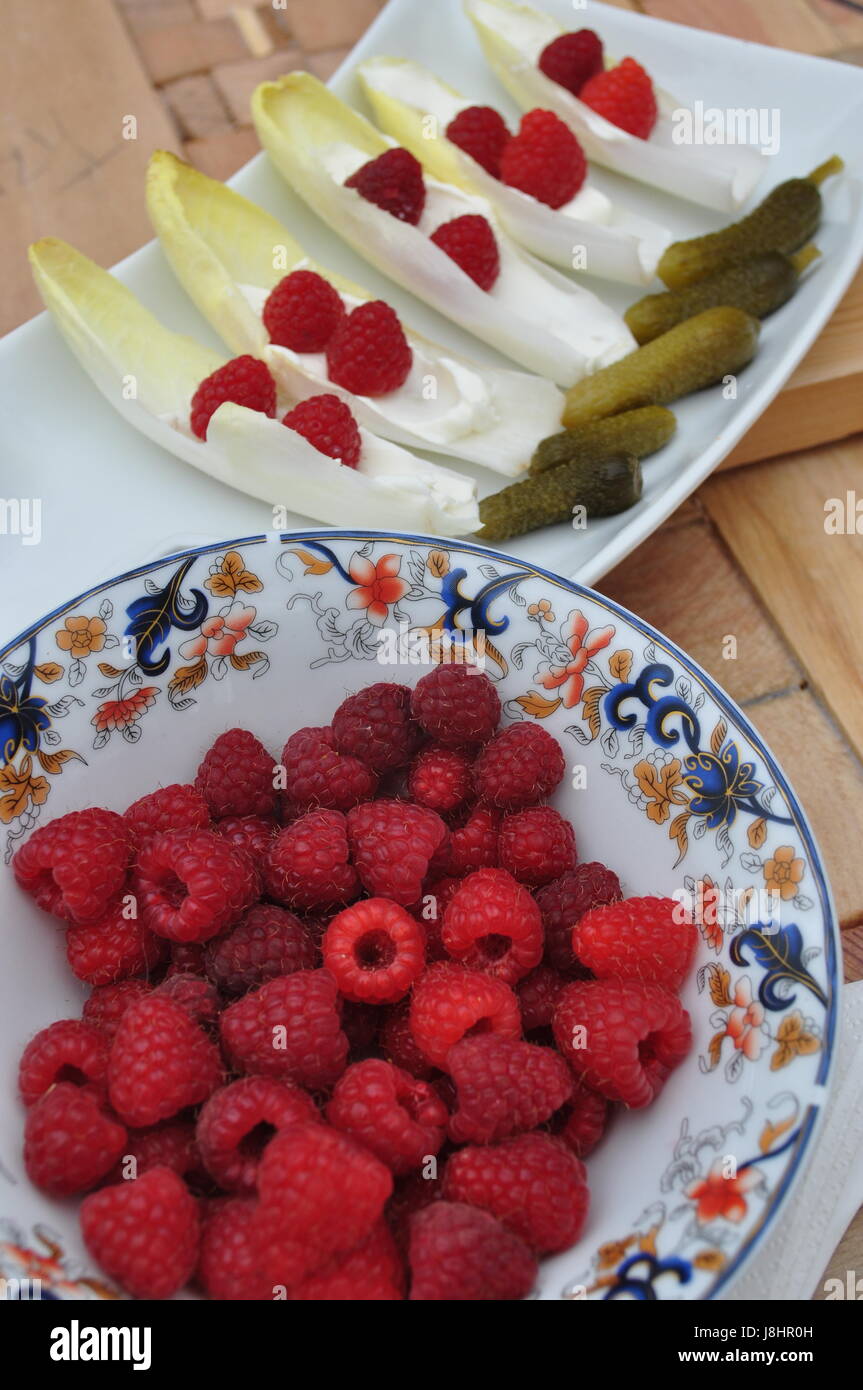 Endives on tray, cheese and raspberries Stock Photo - Alamy