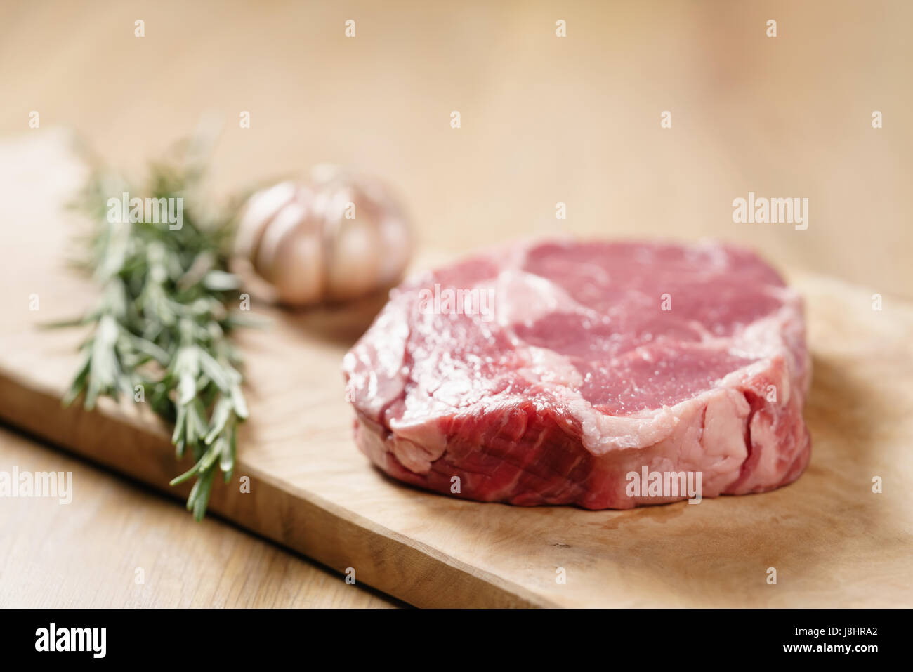 raw rib eye steak on board closeup Stock Photo - Alamy