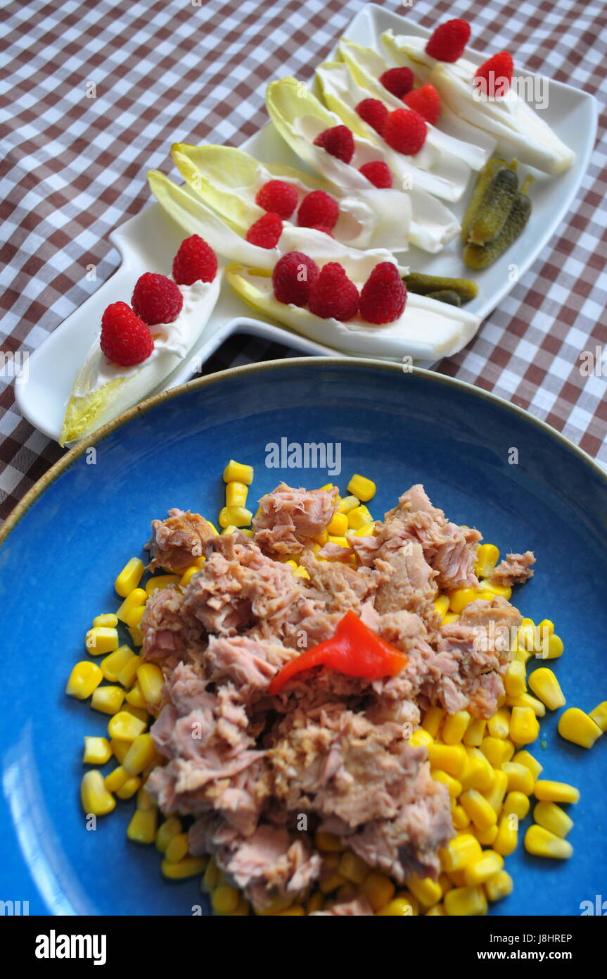 endives with cheese and raspberries and tuna salad with corn Stock ...