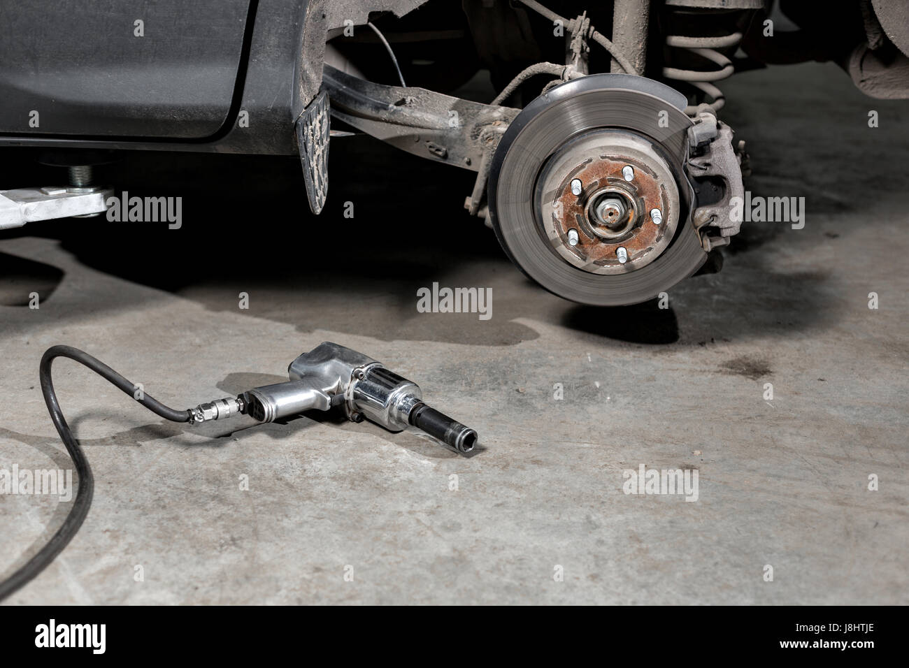 Closeup disc brake of the vehicle for repair. shot wheel, the tool for ...