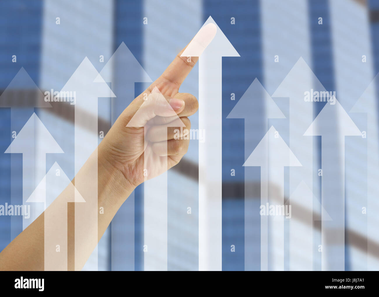 Hand of business man point to the highest point of the arrow in concept ...