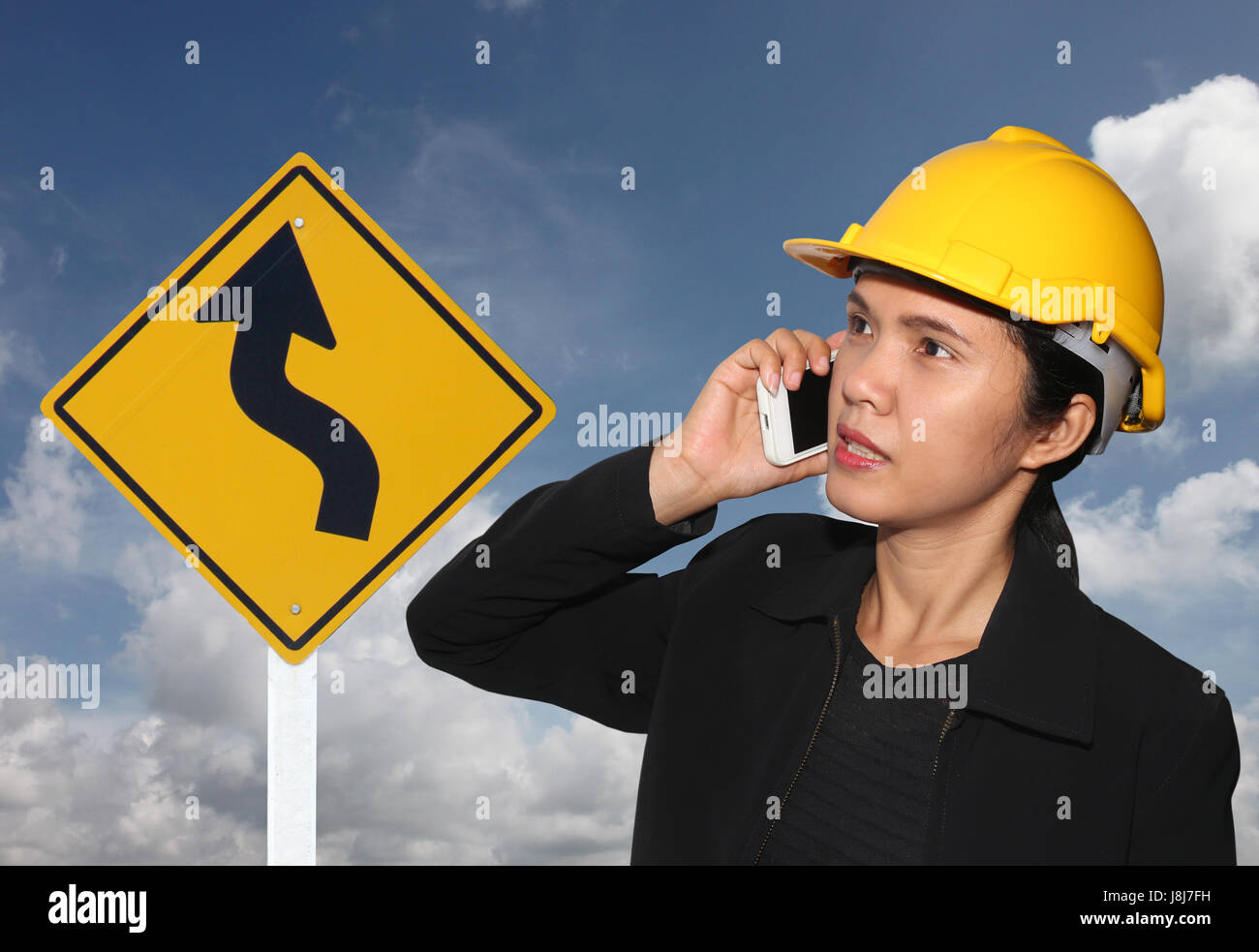 business woman call Smartphone and traffic signs on blue sky background ...