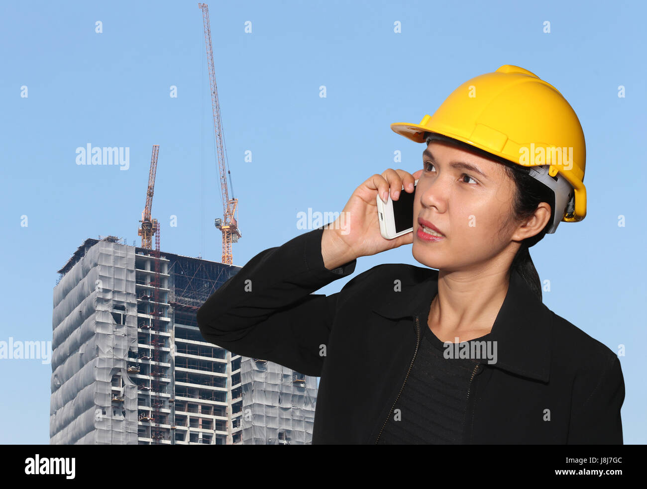 Business woman call smartphone and tall buildings under construction ...