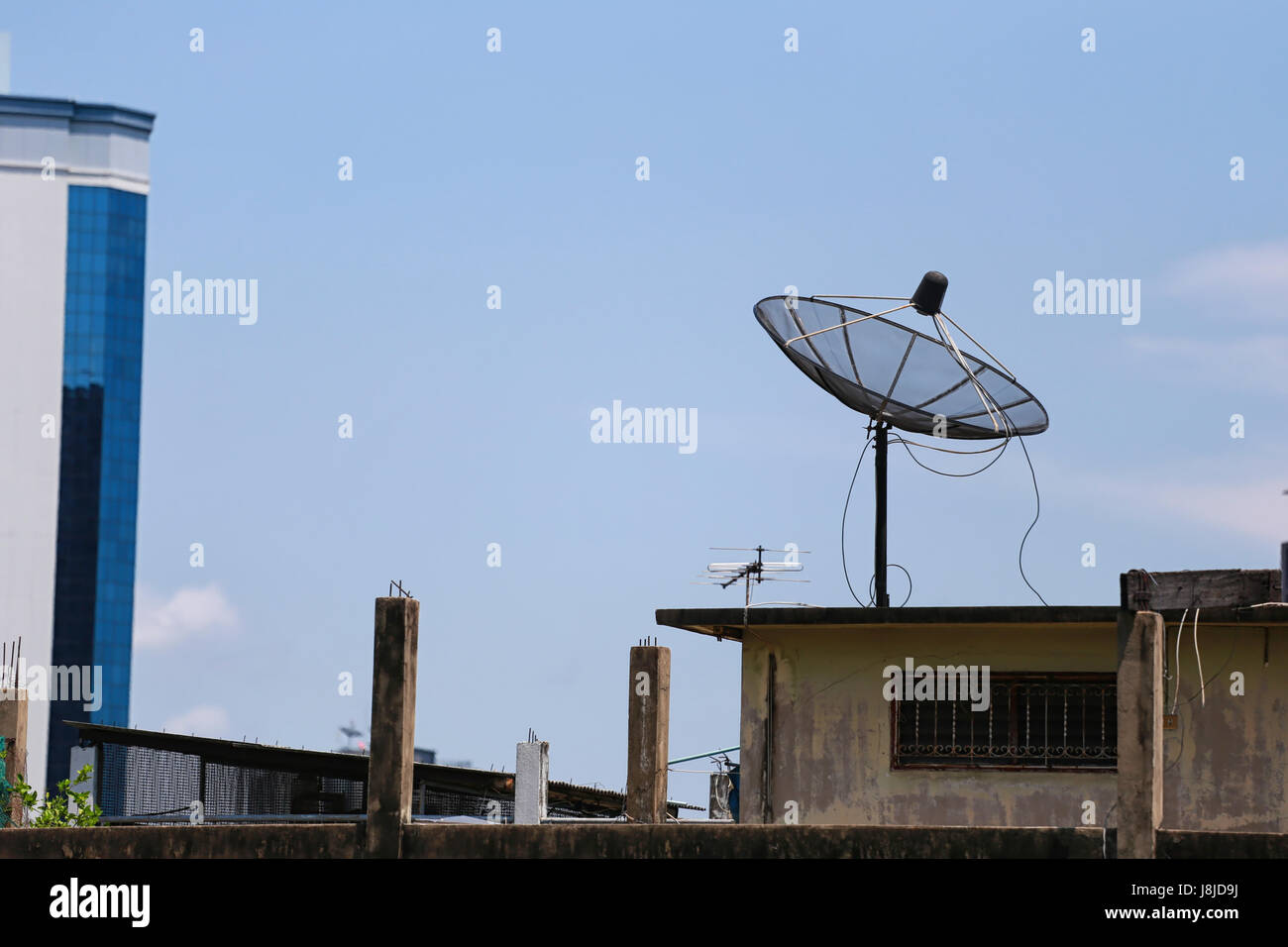 Black Satellite dish on Roof house for Concepts of Connectivity and ...