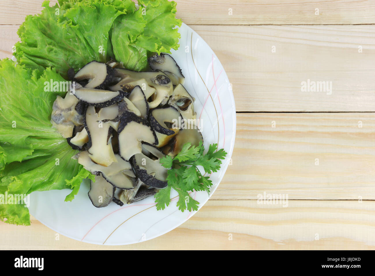 Shellfish of seashell is seafood in white dish and green Lettuce on ...